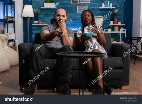 Interracial Couple Sitting Together On Couch Stock Photo Shutterstock