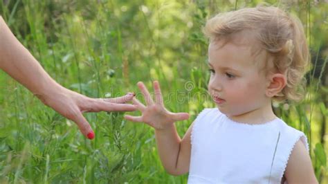 Girl Is Looking At A Ladybug That Is Sitting On Stock Video Video Of