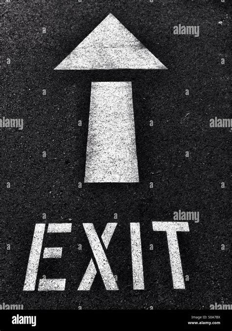 Exit Sign And Arrow On Pavement Stock Photo Alamy