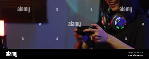 Female Cyber Hacker Gamer Using Controller Joystick To Playing Or Streaming Games On Computer