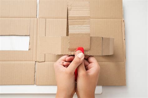 Premium Photo Woman39s Hands Doing Crafts Putting The Cardboard