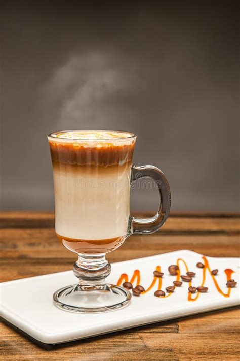 Hot Caramel Macchiato Latte With Coffee Beans And A Drizzle Caramel