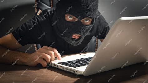 Premium Photo Hacker Stealing Information From The Office Computer Hacking Criminal