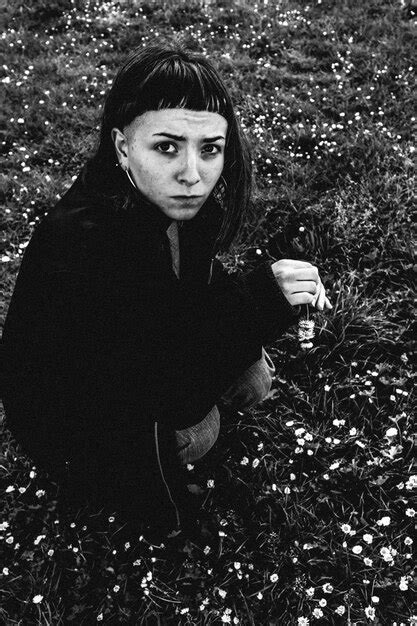 Premium Photo High Angle Portrait Of Teenage Girl Crouching On Land