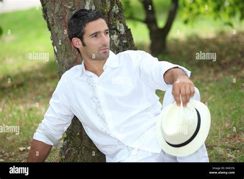 Man Relaxing Under Tree Stock Photo Alamy