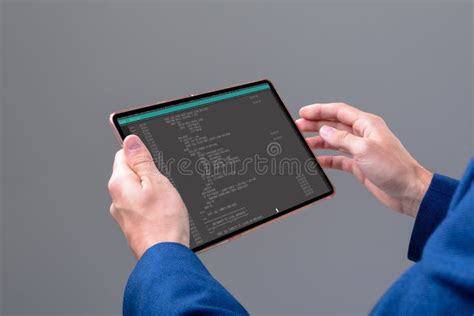 Hands Of Caucasian Male Programmer Using Tablet With Coding On Screen