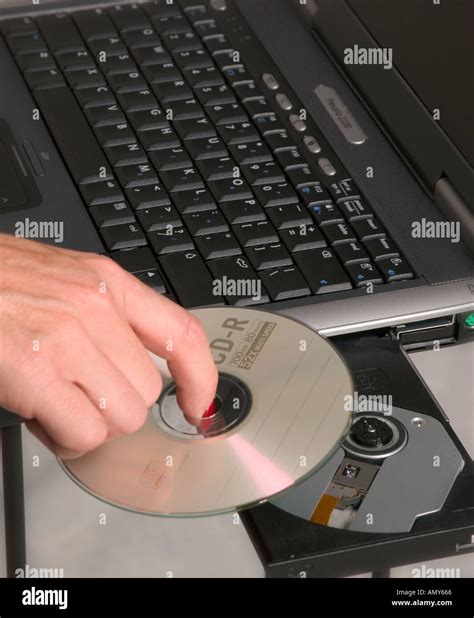 Putting Data Cd Into Computer Hi Res Stock Photography And Images Alamy