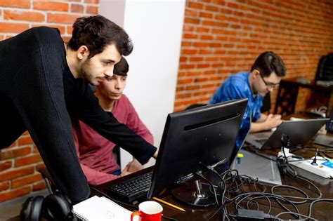 Premium Photo Website Design Programmers Working In A Software Develop Company Office