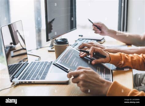 Writing Codes And Typing Data Code Technology Programmer Cooperating Working On Web Site