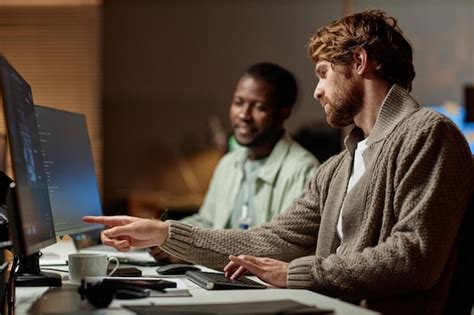 Premium Photo Colleagues Reviewing Data In Office