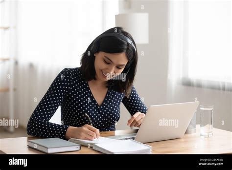 Asian Female Interpreter In Headset Translate Information From Web Conference Stock Photo Alamy