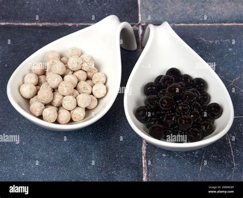 Raw And Cooked Tapioca Balls With Different Flavors Also Known As Boba In Bubble Tea On Gray