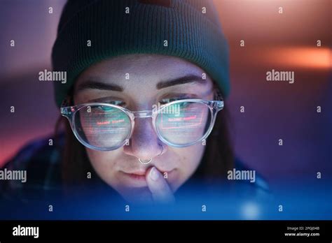 Cyber Security Ransomware And Woman Hacker Working On A Computer In The Basement At Night For