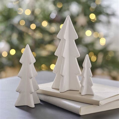 White Ceramic Christmas Trees Set Of Three By The Table Stylist