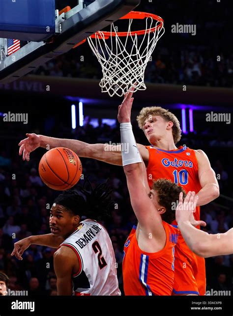 Florida Forward Thomas Haugh 10 Defends Against Uconn Guard Silas