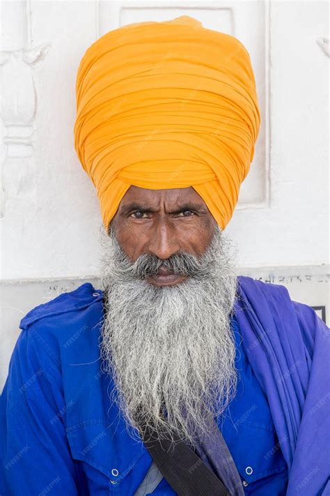 Premium Photo Portrait Of Indian Sikh Man In Orange Turban With Bushy