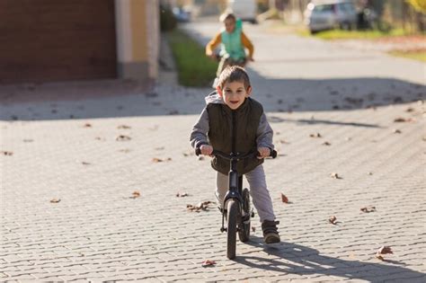 Premium Photo Portrait Of Cute Girl Riding Bicycle On Street