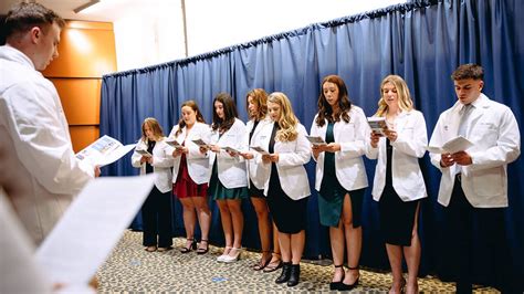 With Compassion And Excellence Katherine Harris White Coat Ceremony Cloaks Dpt Class Of 2024