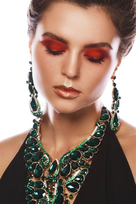 Woman Wearing Big Beautiful Necklace And Earrings With A Lot Of Gems