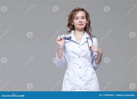 Female Doctor With Stethoscope Standing And Looking At Camera Stock