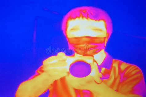 Abstract Infrared Thermography Image Showing The Heat Emission When Man Used A Camera Thermal