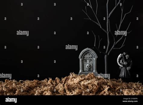 Halloween Background With Tombstone That Have Black Tree And Blurred