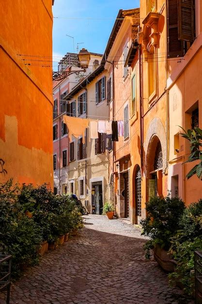 Premium Photo Picturesque Small Cobblestone Alley In Trastevere With