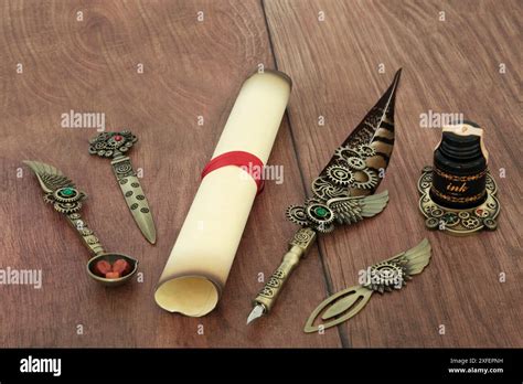 Parchment Faded Paper Scroll With Feather Quill Nib Pen And Old Brass Writing Equipment For
