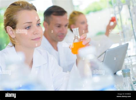 Female Lab Technician With Dreamy Expression Stock Photo Alamy