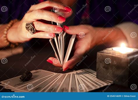 Fortune Teller Hands Shuffling Tarot Cards Close Up Moody Atmosphere
