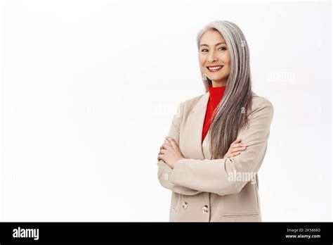 Portrait Of Professional Asian Senior Businesswoman Cross Arms On