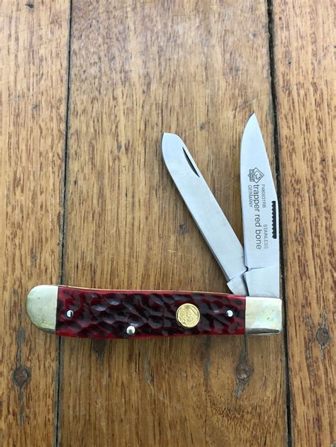 Puma Knife Puma Trapper Lockback Knife With Jigged Red Bone Handle