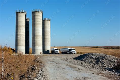 Tall Cement Silos Next To A Control Station Pipes Transport Mixed