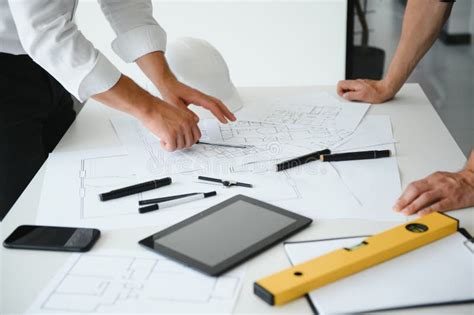 Engineer Or Architect Teamwork Working On Construction Project With Building Model And Blueprint