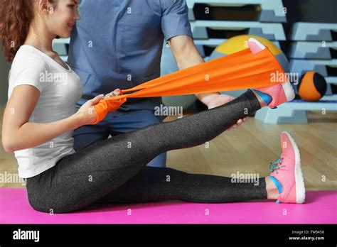 Rehabilitation Concept Young Woman Doing Exercises Under Physiotherapist Supervision Stock