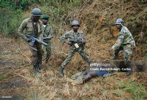 Afl Soldiers Stand Over The Body Of A Young Man Killed During The