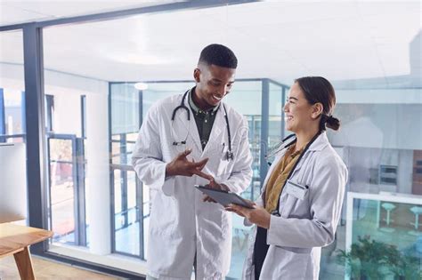 Looks Like Youve Solved It Two Young Doctors Working On A Digital