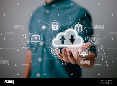 A Man Holding A Cloud Computing Diagram Displayed On The Screen