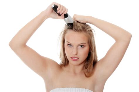 Premium Photo Woman Cutting Hair Over White Background