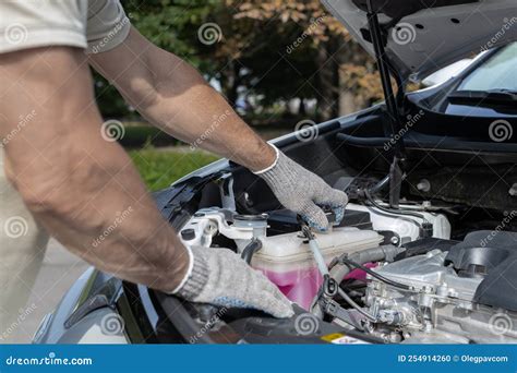 Man Check The Coolant Level In The Car Stock Photo Image Of Medium Plug 254914260