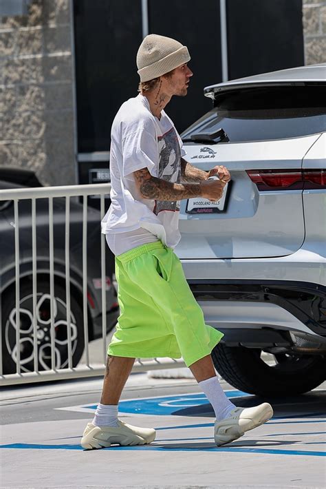 Justin Bieber Embarrasses Wife Hailey By Walking With Shorts Hanging