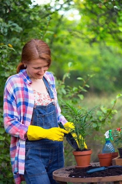 Premium Photo Girl Plants A Plant