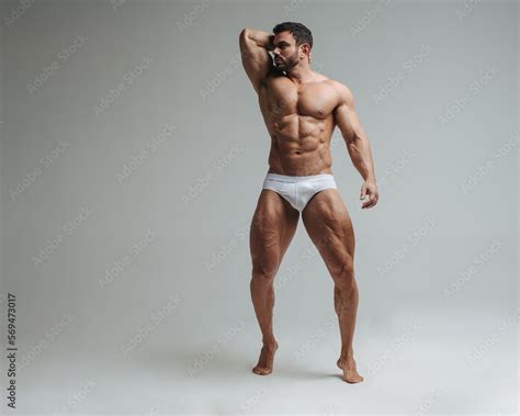 Sexy Muscular Man In White Underwear Posing In Studio Handsome
