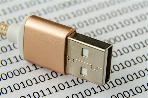 Free Photo Closeup Shot Of A USB Cable On A Piece Of Paper With Numbers And Codes Written On It