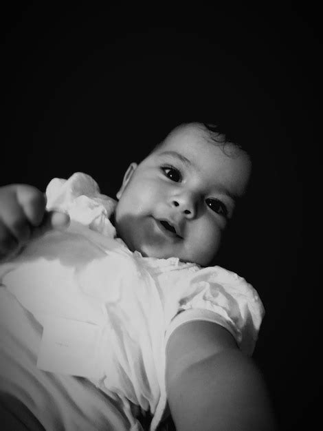 Premium Photo Portrait Of Cute Girl Lying On Bed