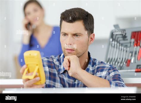 An Electrician Measuring The Voltage Stock Photo Alamy