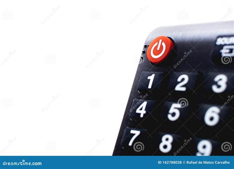 Photograph Of The Power Button Of A Television Remote Control Stock