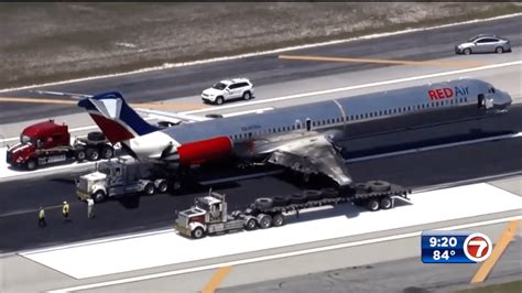 Red Air Plane Removed From Mia Runway As Ntsb Officials Continue Crash Landing Investigation