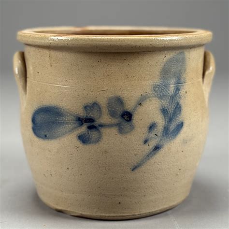 Lot 047 Stoneware Ovoid Crock With Blue Flower Decoration 7 14” H