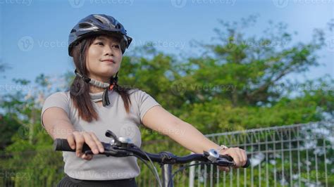 Young Asian Woman Enjoying Cycling In Summer Morning 6341010 Stock